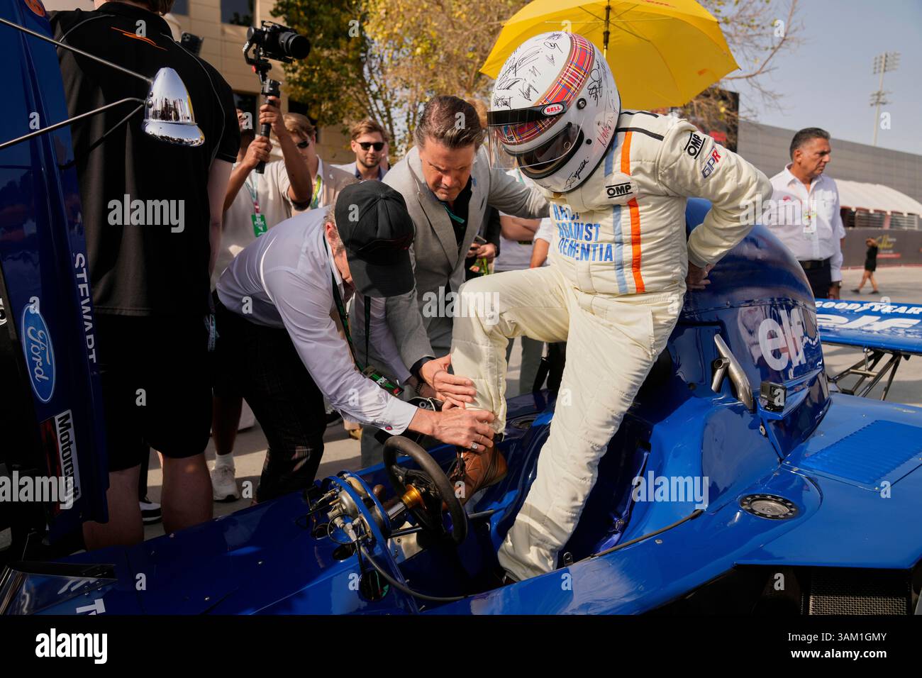 Former Formula One Champion Jackie Stewart enters his original car and ...