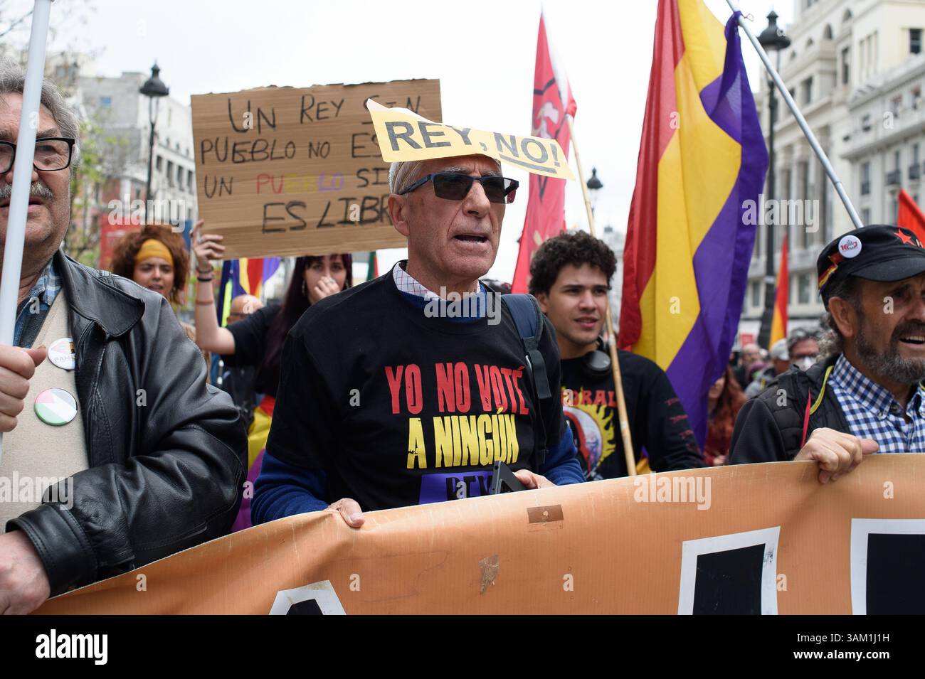 People protest during a march against the monarchy, the end of King ...