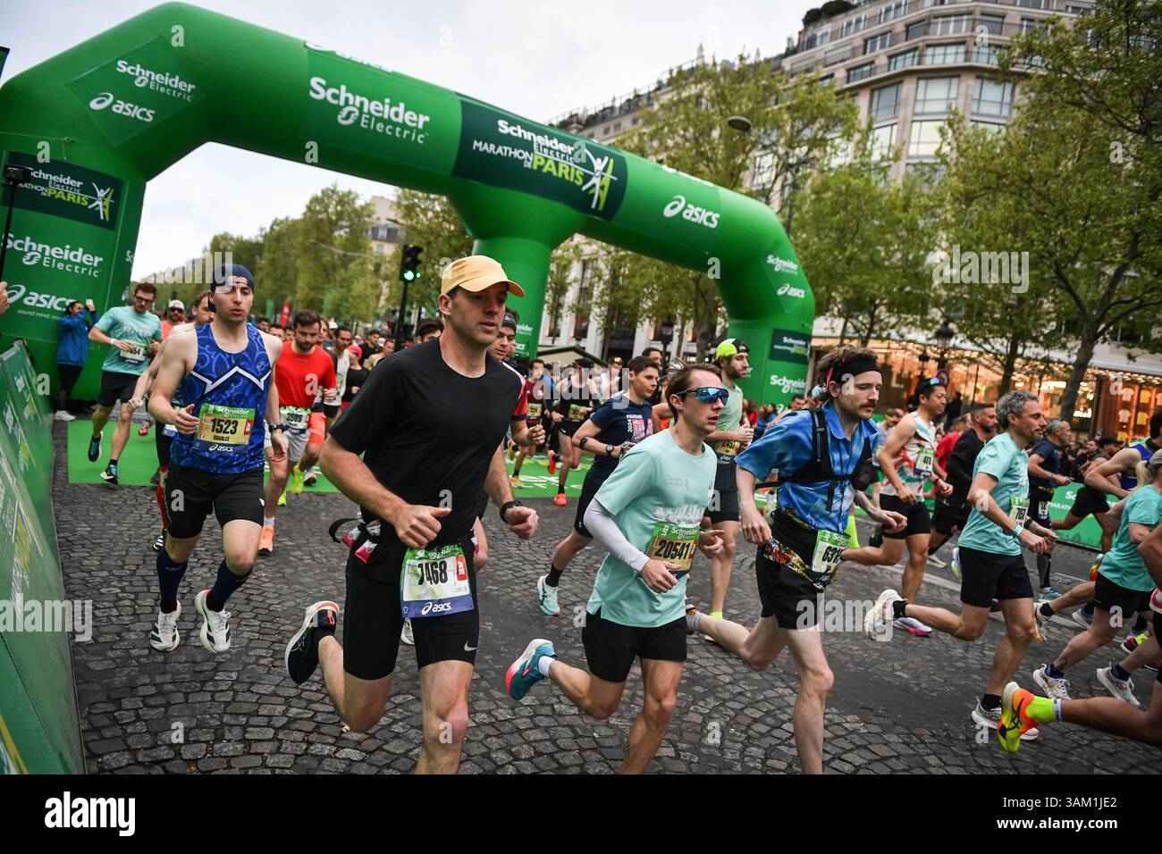 Paris, France. 13th Apr, 2025. Runners participate in the Paris ...
