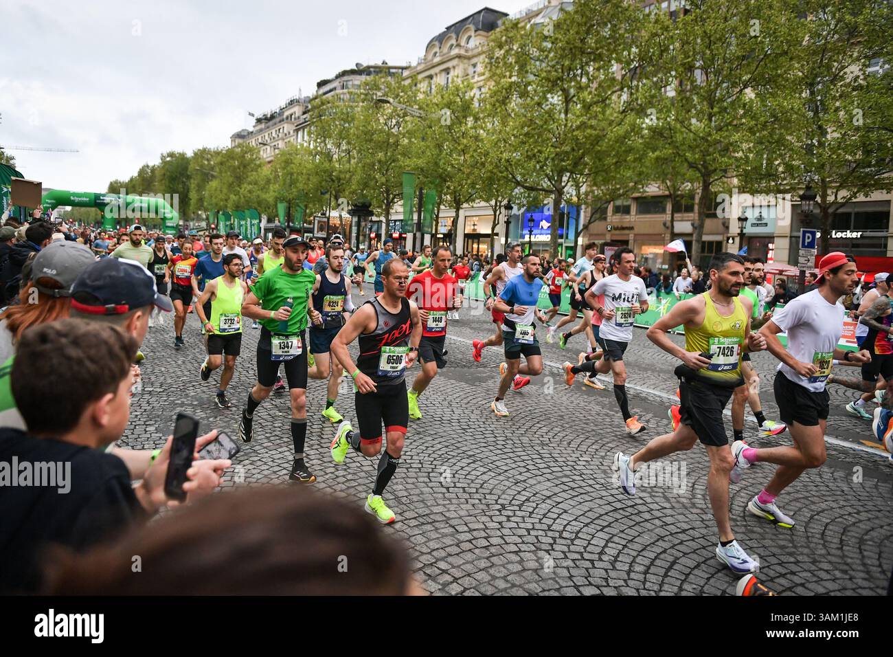 Paris, France. 13th Apr, 2025. Runners participate in the Paris ...