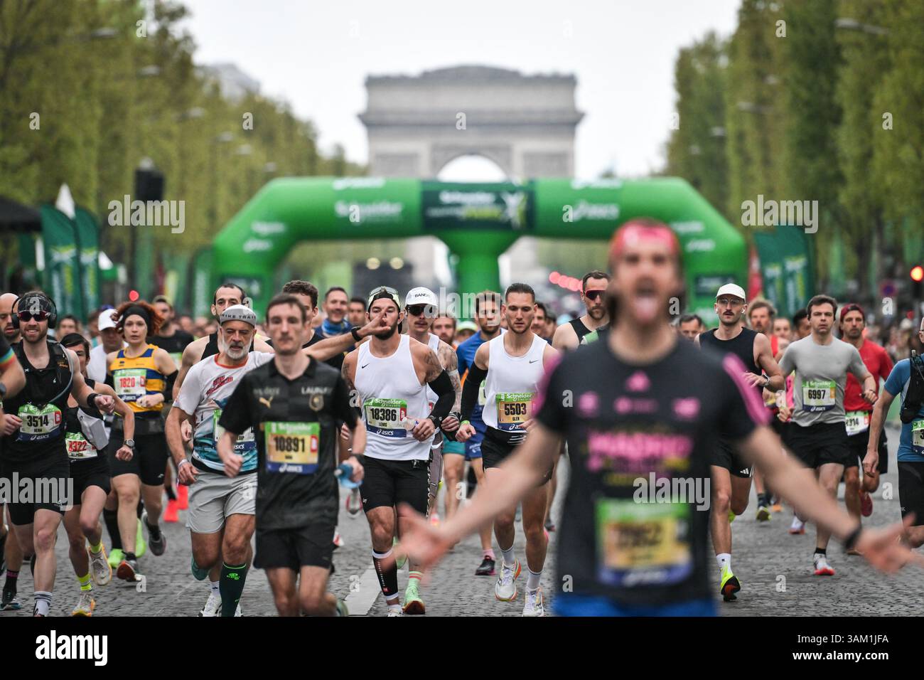 Paris, France. 13th Apr, 2025. Runners participate in the Paris ...
