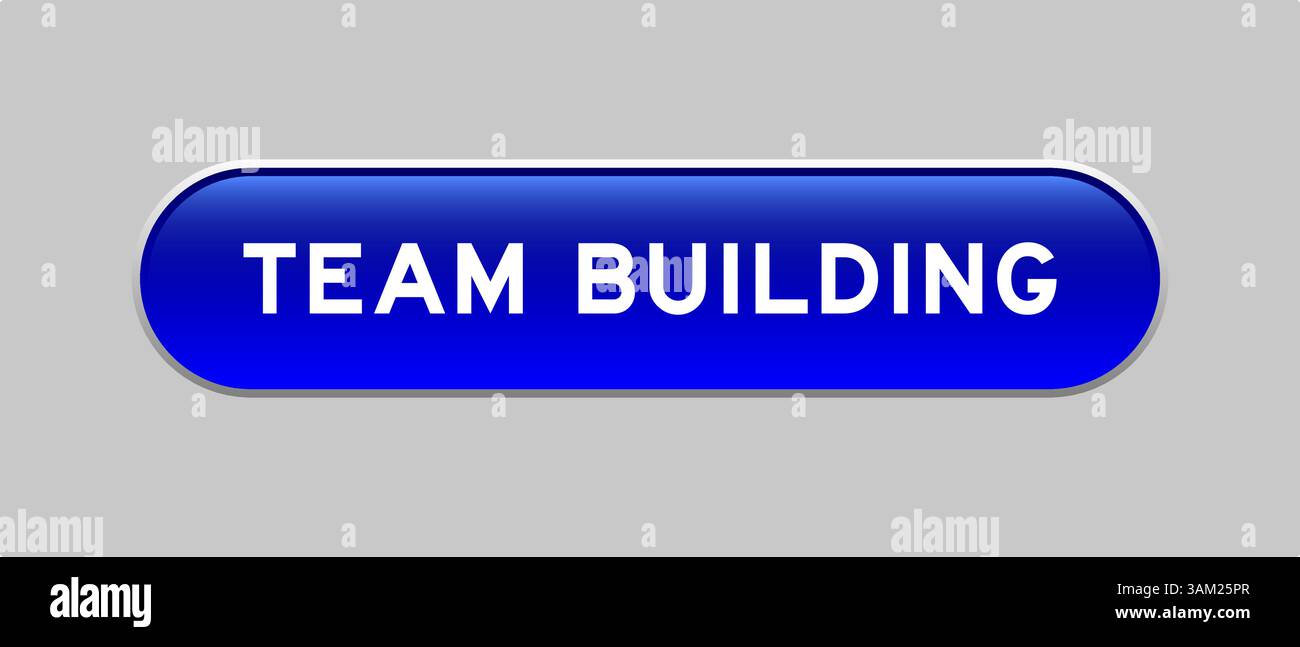 Blue color capsule shape button with word team building on gray ...
