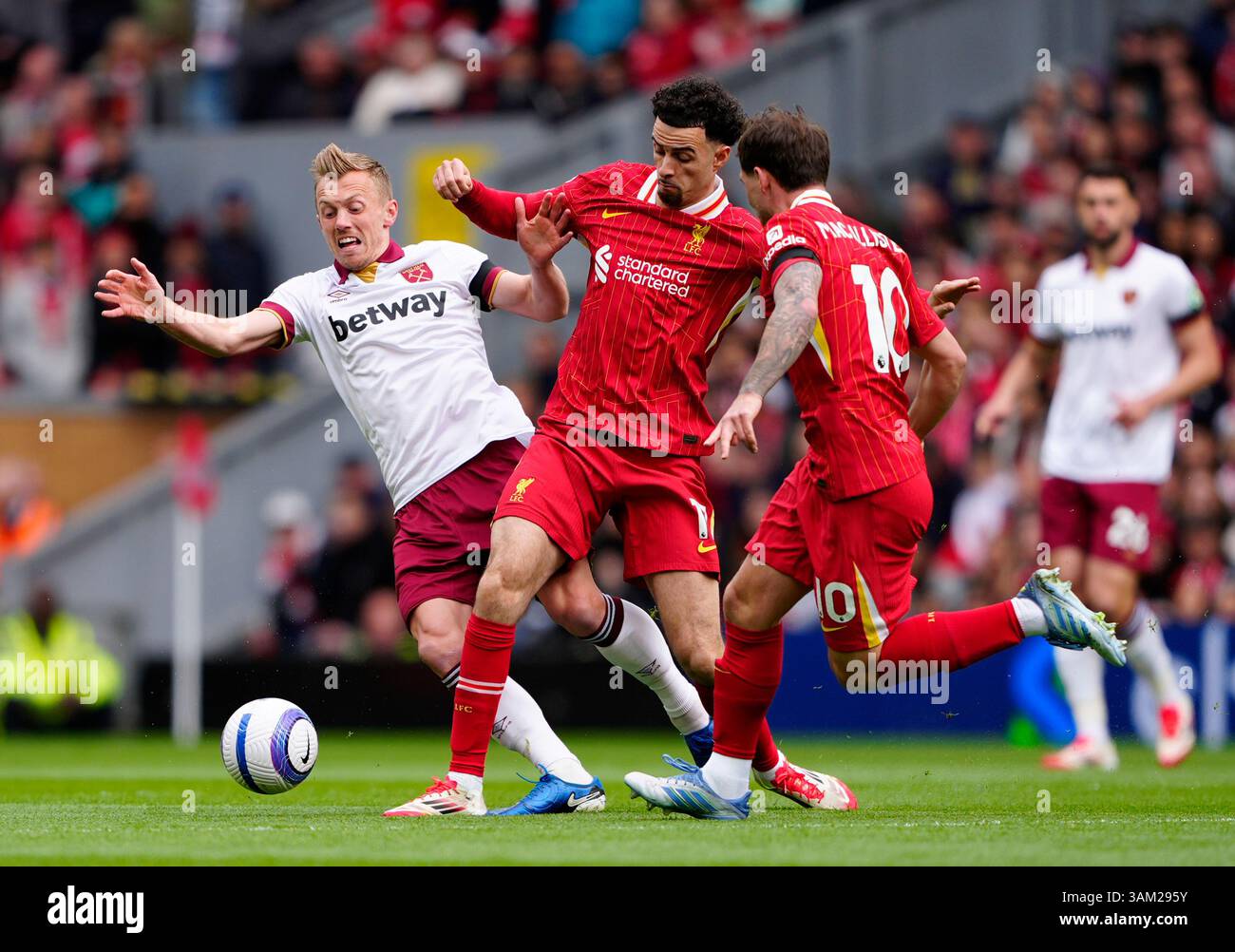 West Ham United's James Ward-Prowse (left) battles for the ball with ...