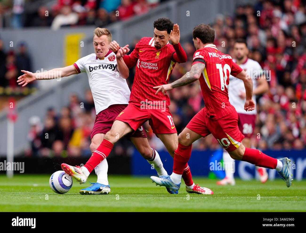 West Ham United's James Ward-Prowse (left) battles for the ball with ...