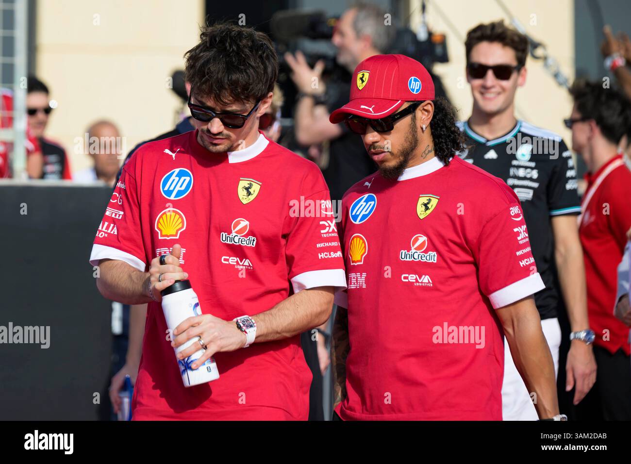 Sakhir, Bahrain. 13th April 2025. Charles Leclerc and Lewis Hamilton of ...