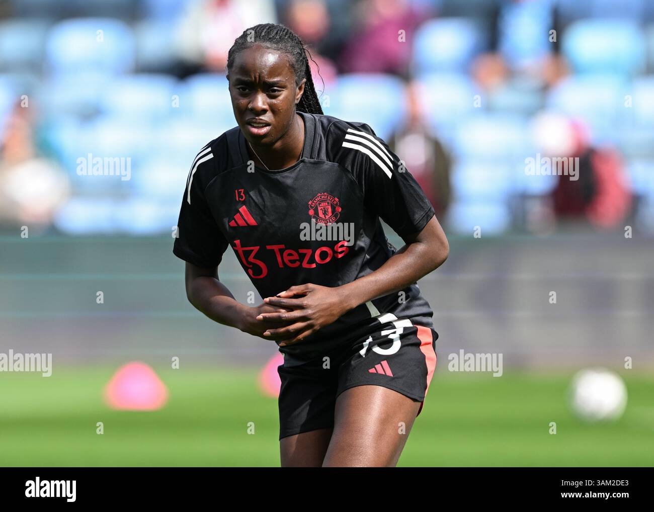 Manchester, UK. 13th Apr, 2025. Simi Awujo of Manchester United Women warms up ahead of the ...