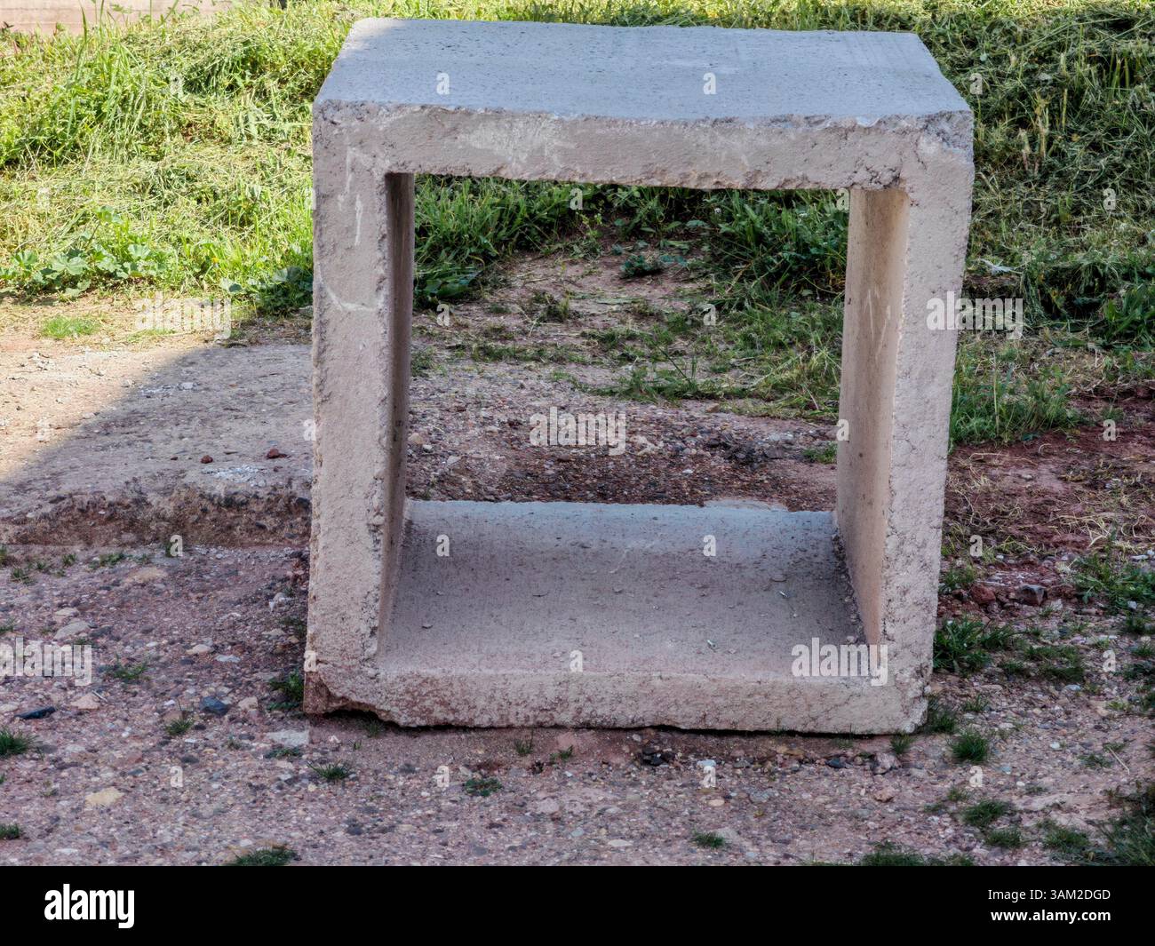 Weight of Stillness: Concrete Frame on Dirt Soil Stock Photo - Alamy