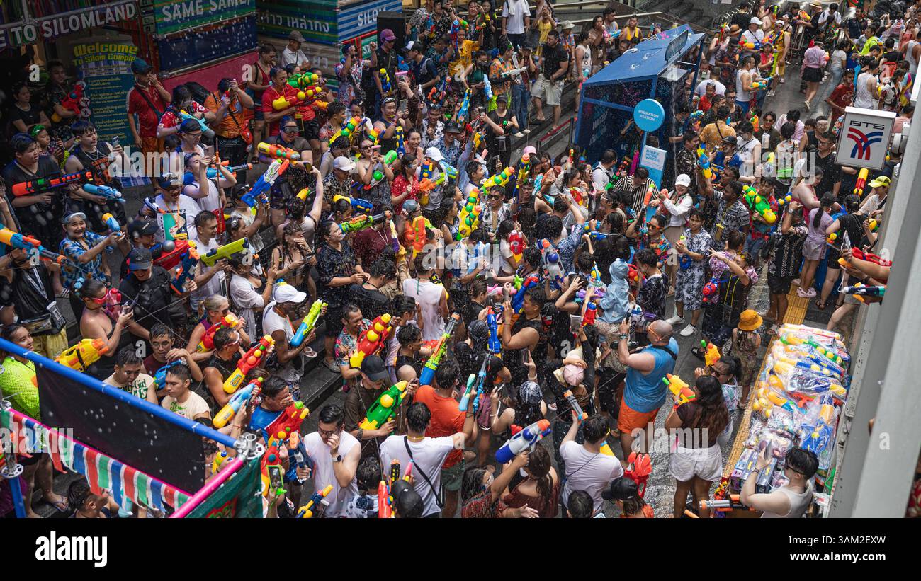 People participate in water gun fights during Songkran celebrations in ...