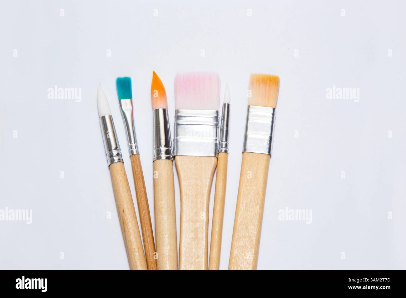 Set of various colorful paint brushes for drawing on white background ...