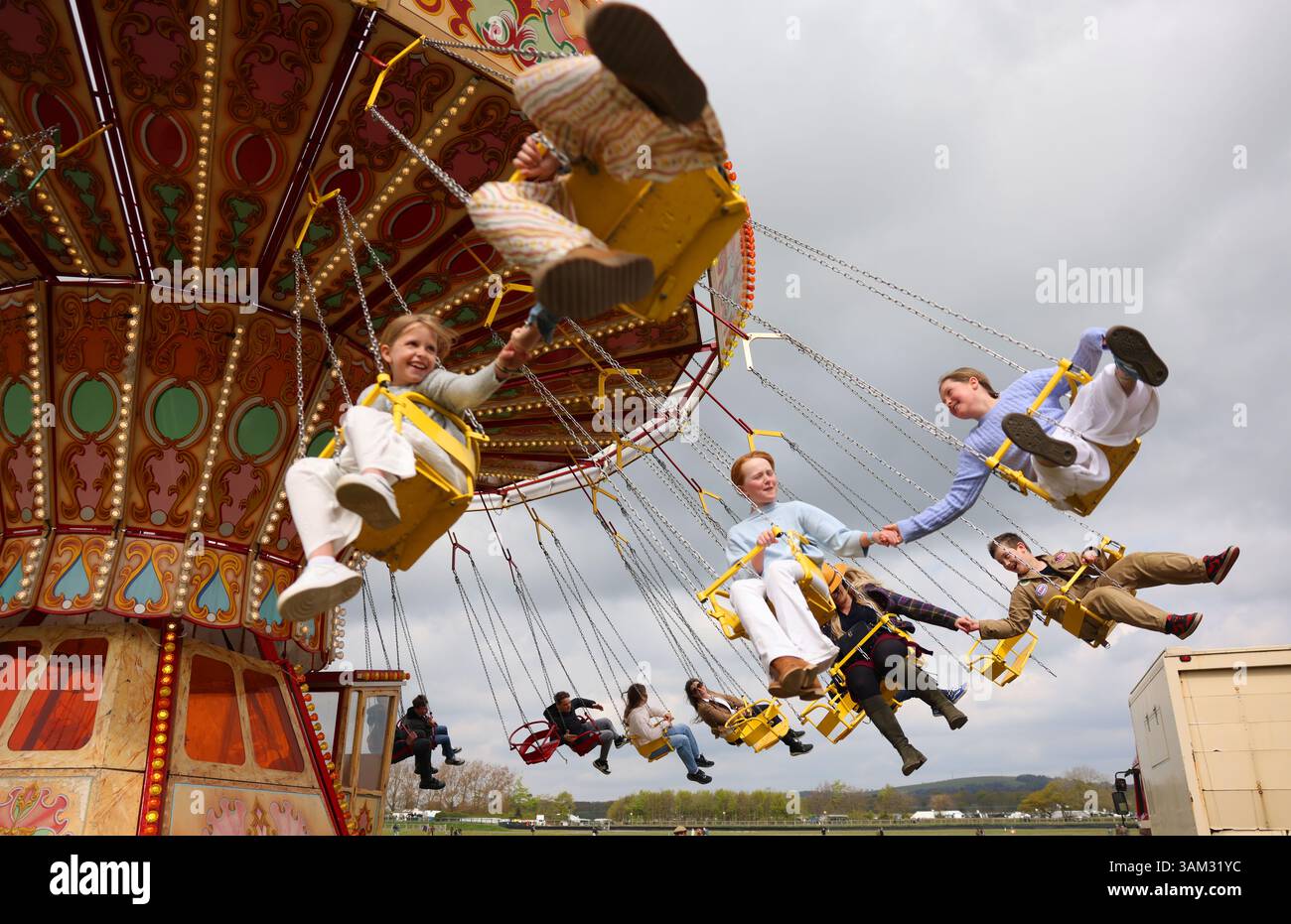 Race meet goers on the vintage fun fair at the 82nd Members' Meeting at ...