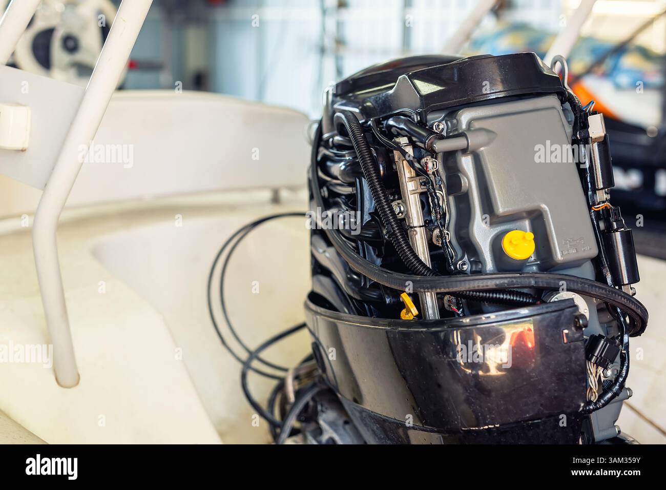 Repairing inflatable motorboat engine at boat garage. Ship engine ...
