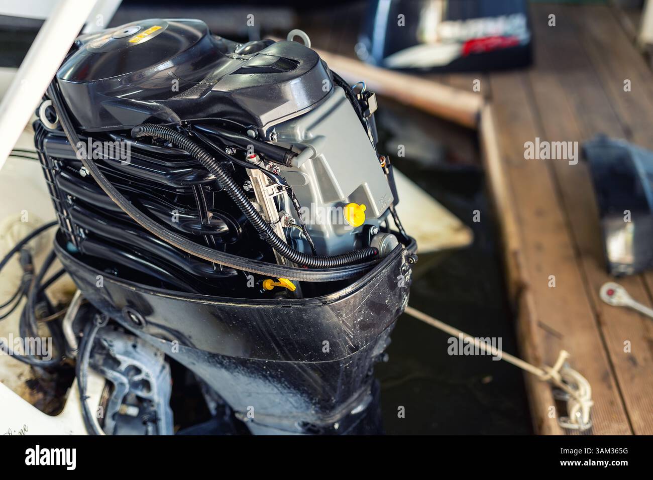 Repairing inflatable motorboat engine at boat garage. Ship engine ...