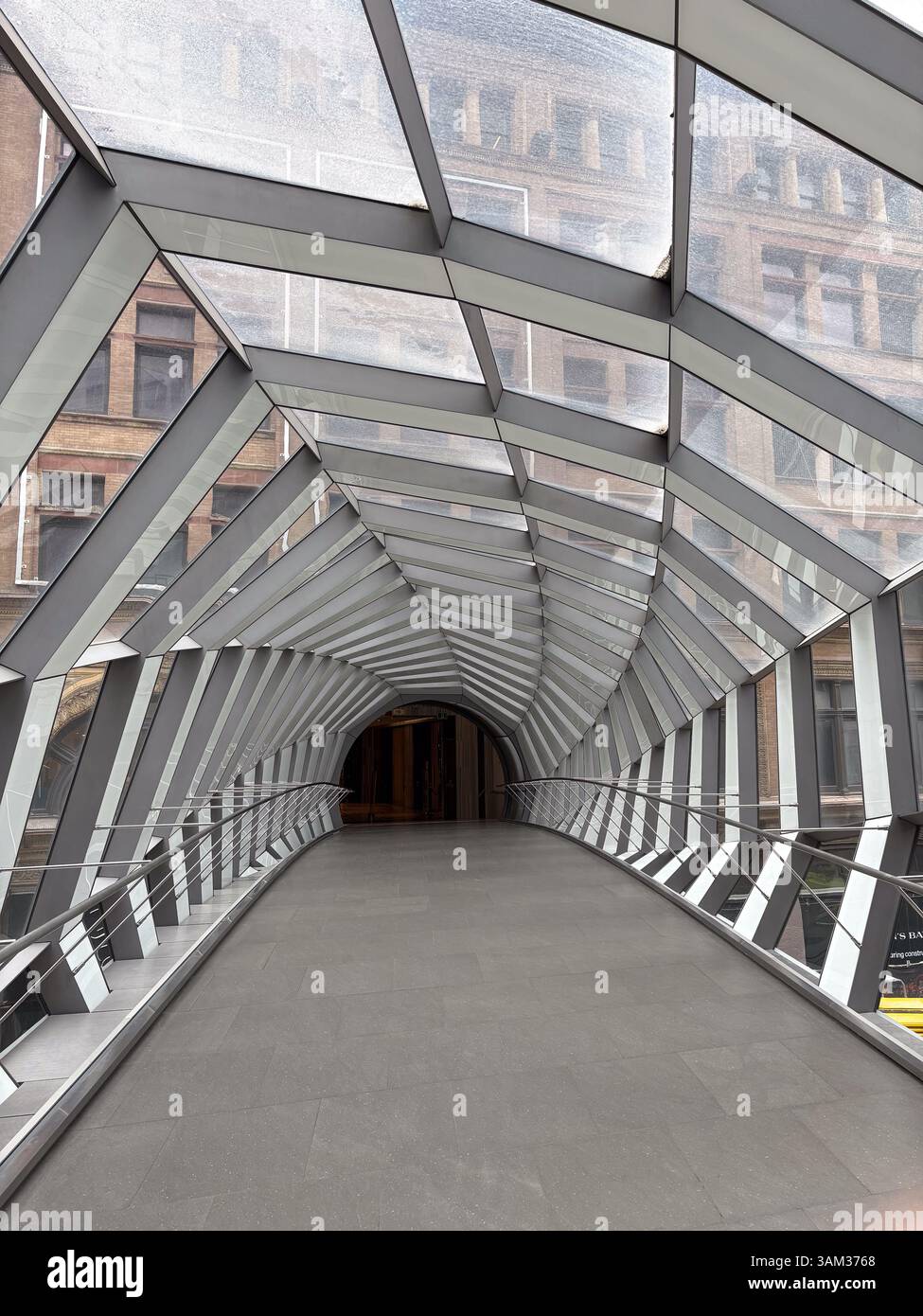 The 16th street pedestrian bridge in Denver, Colorado features a glass ...