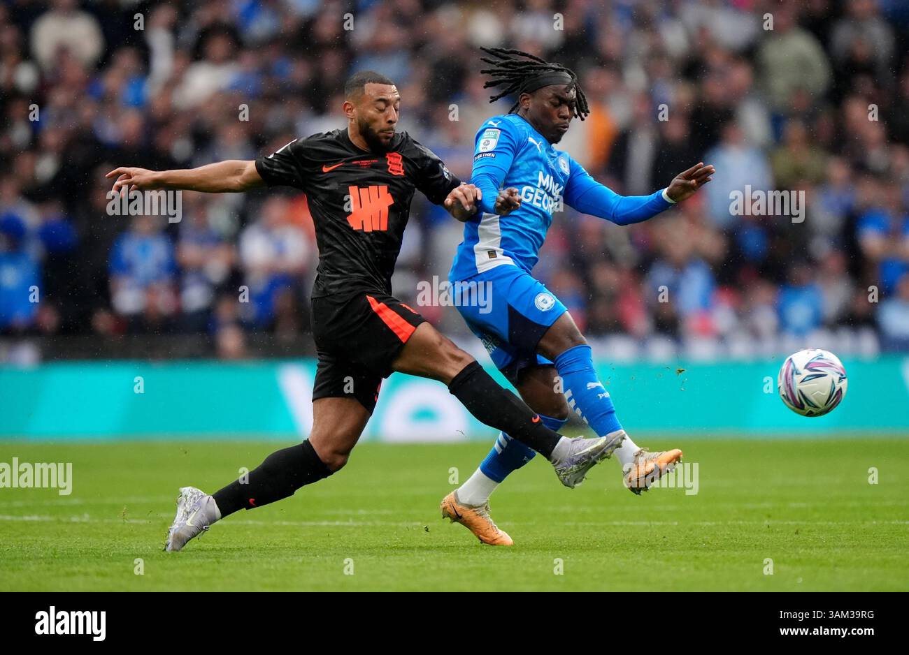 Birmingham City's Keshi Anderson (left) and Peterborough United's ...