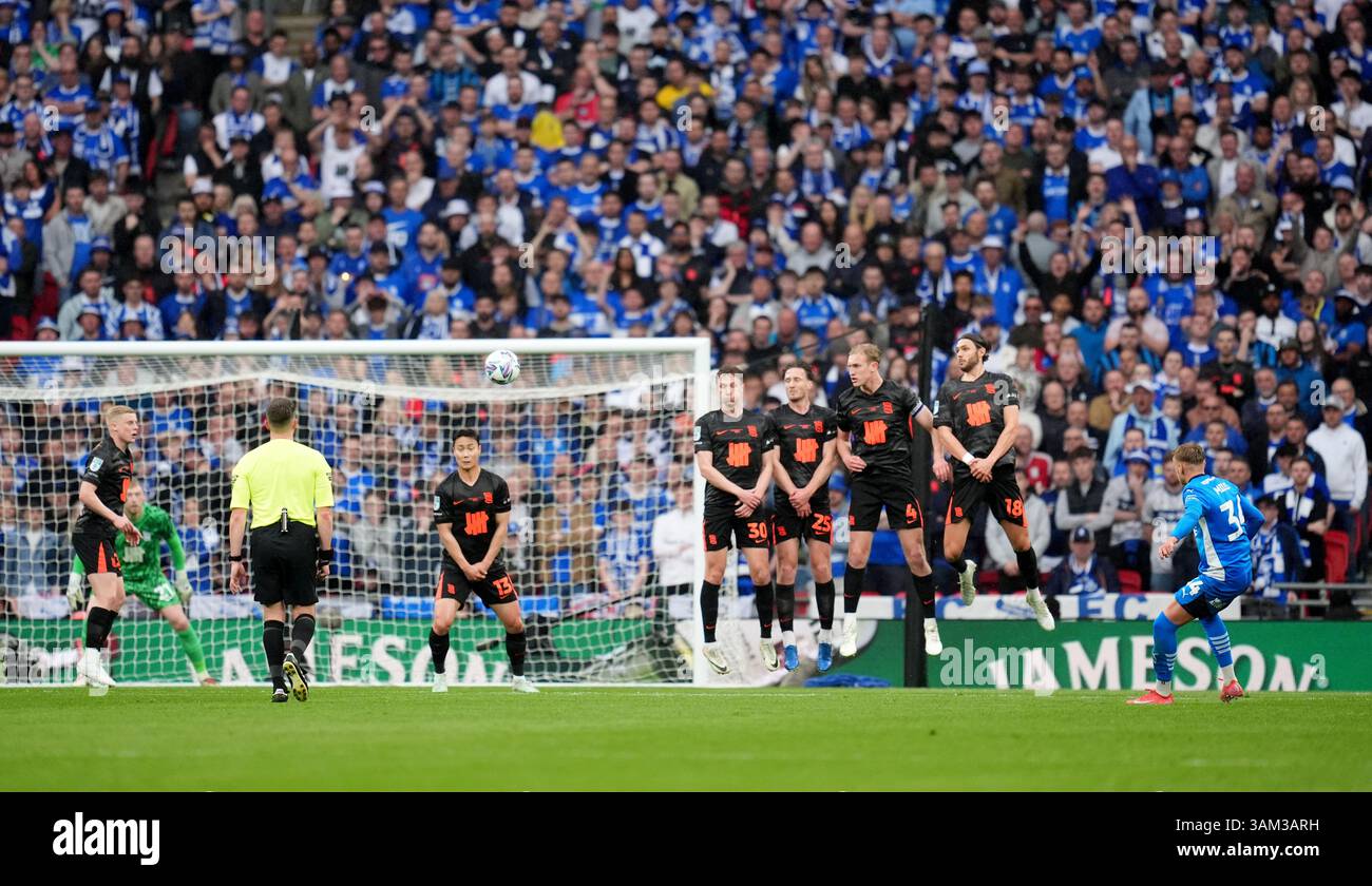 Peterborough United's Harley Mills scores their side's first goal of the game during the Vertu ...