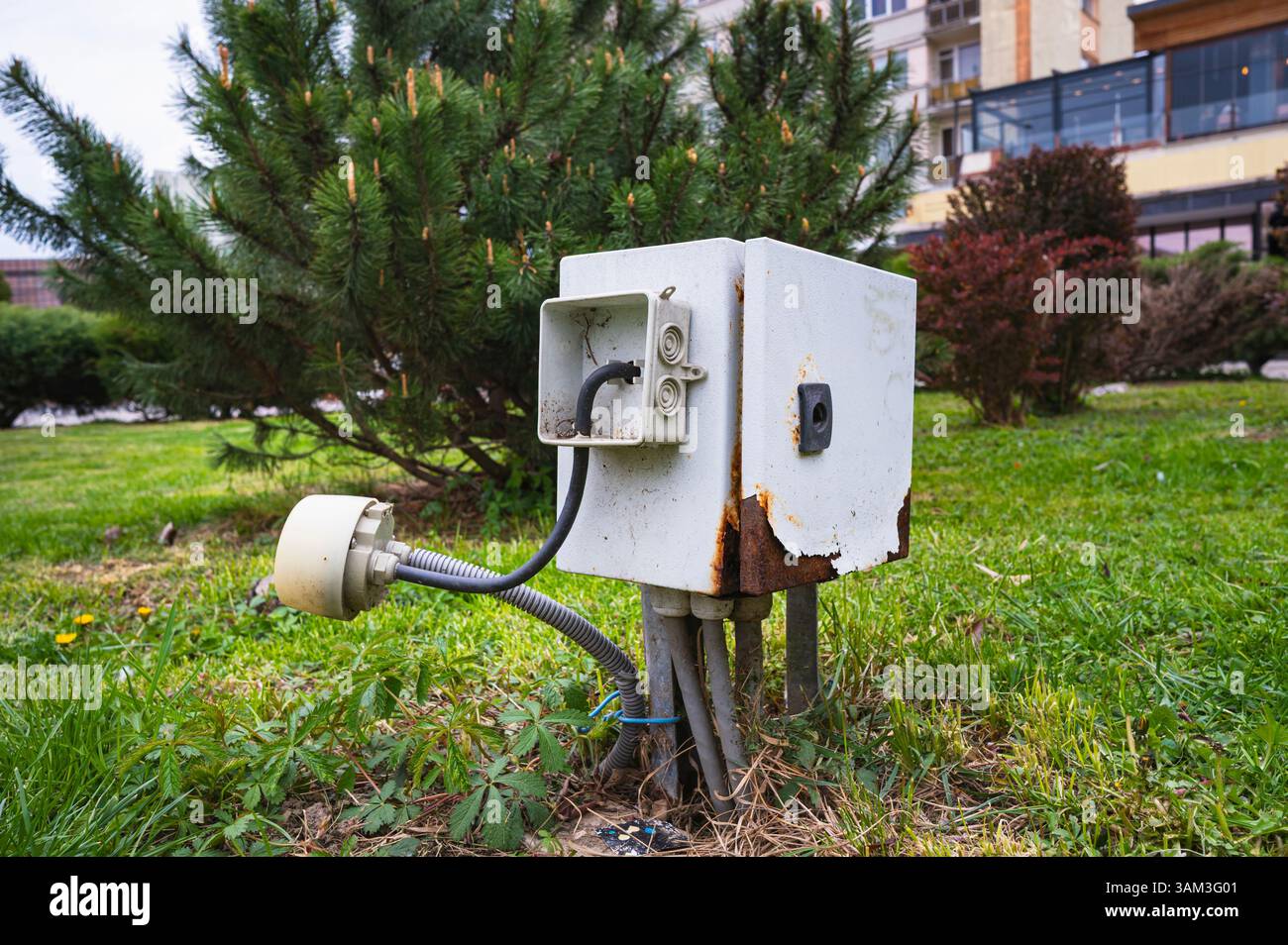 old rusty electrical box with improvised modifications suggests danger ...