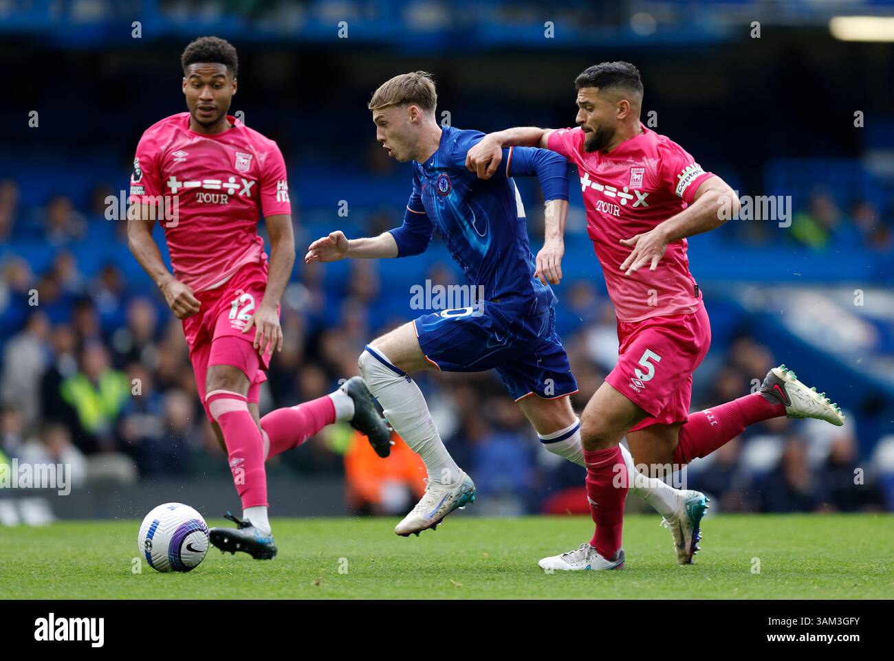 Chelsea's Cole Palmer (centre) is tackled by Ipswich Town's Sam Morsy ...