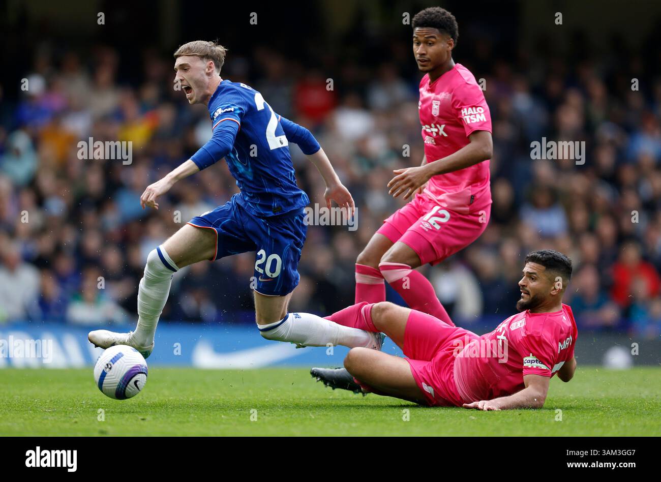 Chelsea's Cole Palmer (left) is tackled by Ipswich Town's Sam Morsy ...