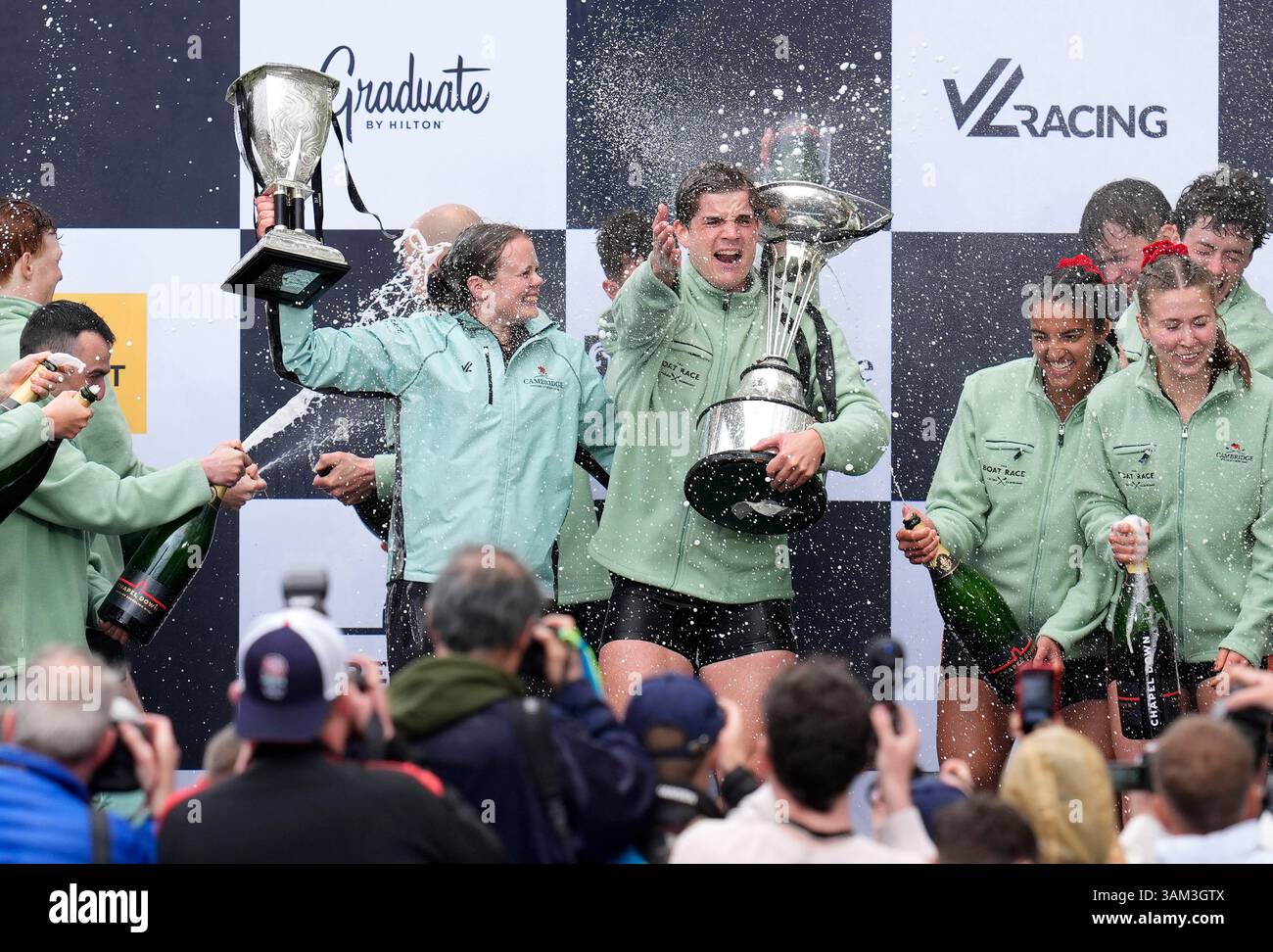 Cambridge women's team and Cambridge men's team rowers celebrate with ...