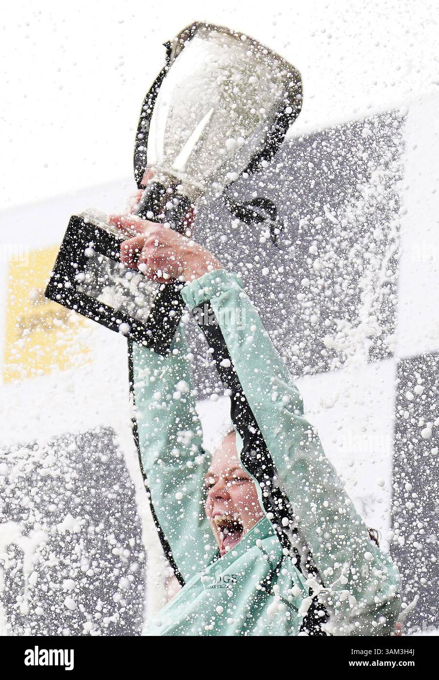 Cambridge Women's President Lucy Havard lifts the trophy as they ...