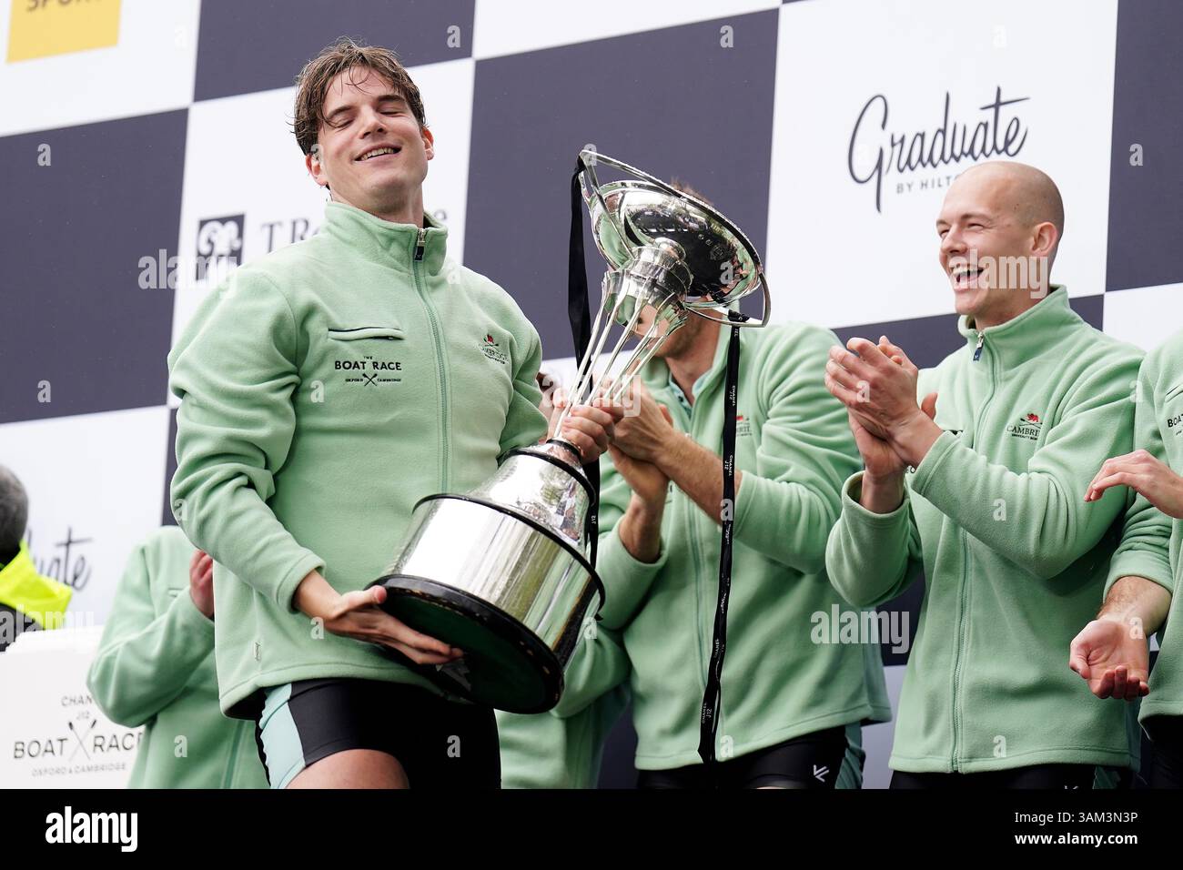 Cambridge Men's President Luca Ferraro with the trophy as they ...