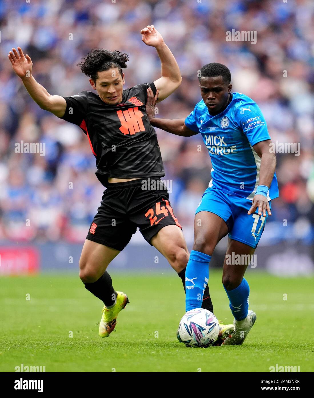 Peterborough United's Kwame Poku (right) and Birmingham City's Tomoki ...