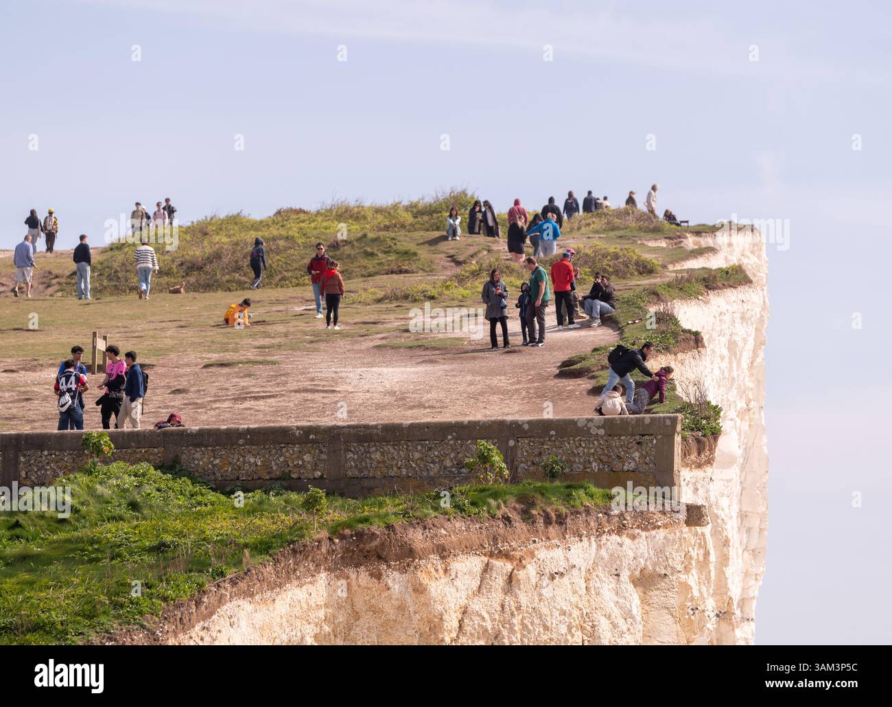 Birling Gap, East Sussex, UK. 13th April, 2025. People go precariously ...