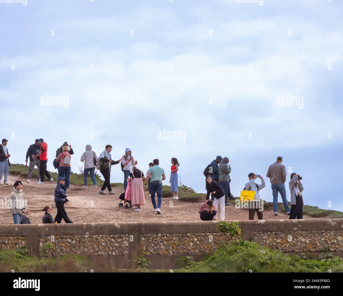 People go precariously close to the cliff edges as birling hi-res stock ...
