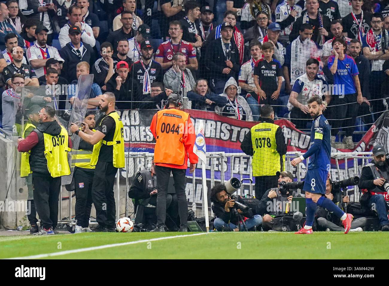 Lyon, France. 10th Apr, 2025. Security staff hold up shields to protect ...