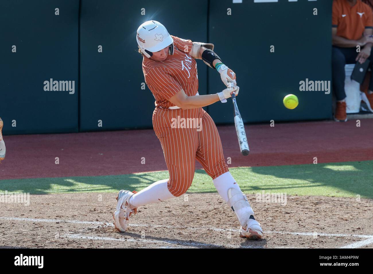 AUSTIN, TX - APRIL 12: Texas utility Katie Stewart (20) hits a fly ball ...