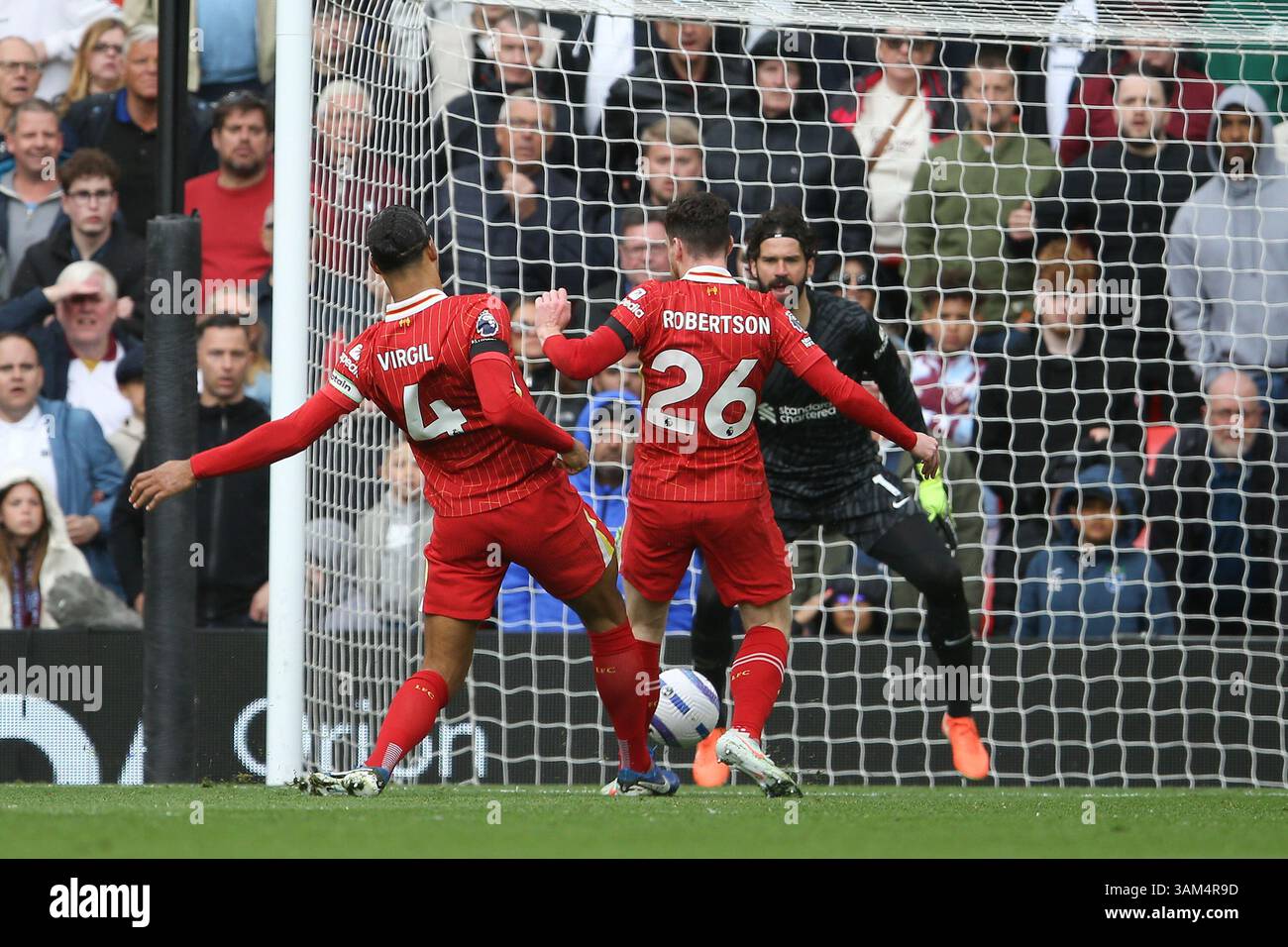 Liverpool, UK. 13th Apr, 2025. Virgil van Dijk of Liverpool and Andy ...