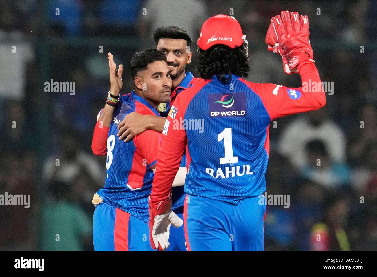 Delhi Capitals' Vipraj Nigam, left, celebrates with teammates the ...