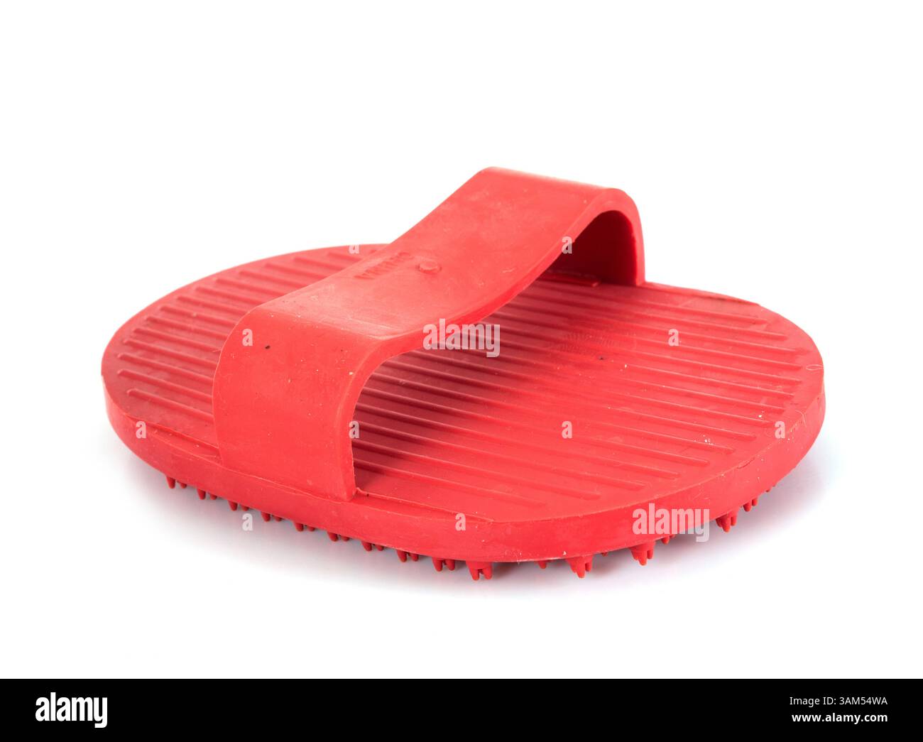 rubber brush for dog in front of white background Stock Photo - Alamy
