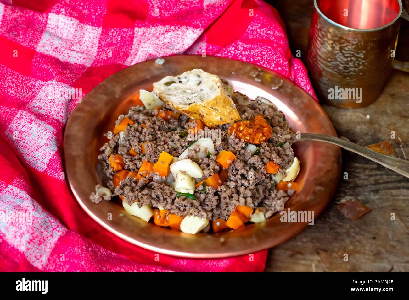 Traditional dish with ground beef and vegetables on an old plate and ...