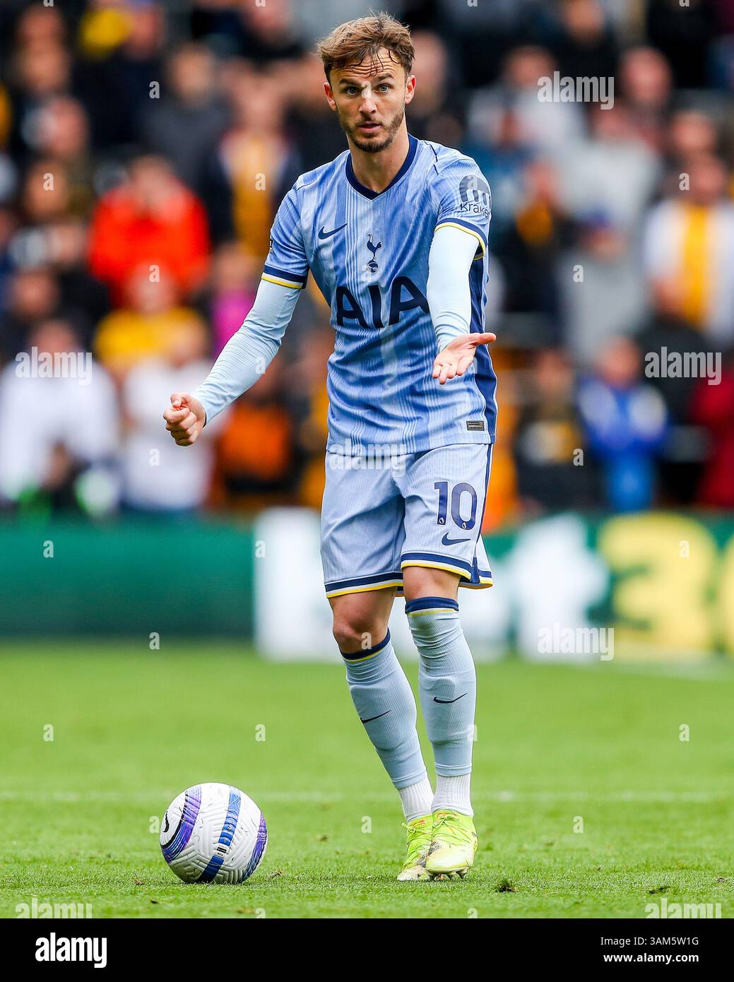 James Maddison of Tottenham Hotspur runs with the ball during the ...
