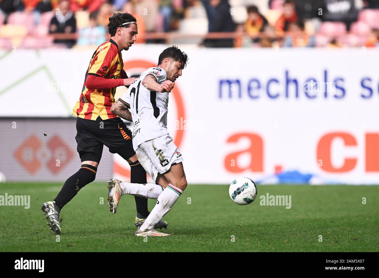Mechelen, Belgium. 13th Apr, 2025. Mechelen's Jose Marsa and OHL's ...