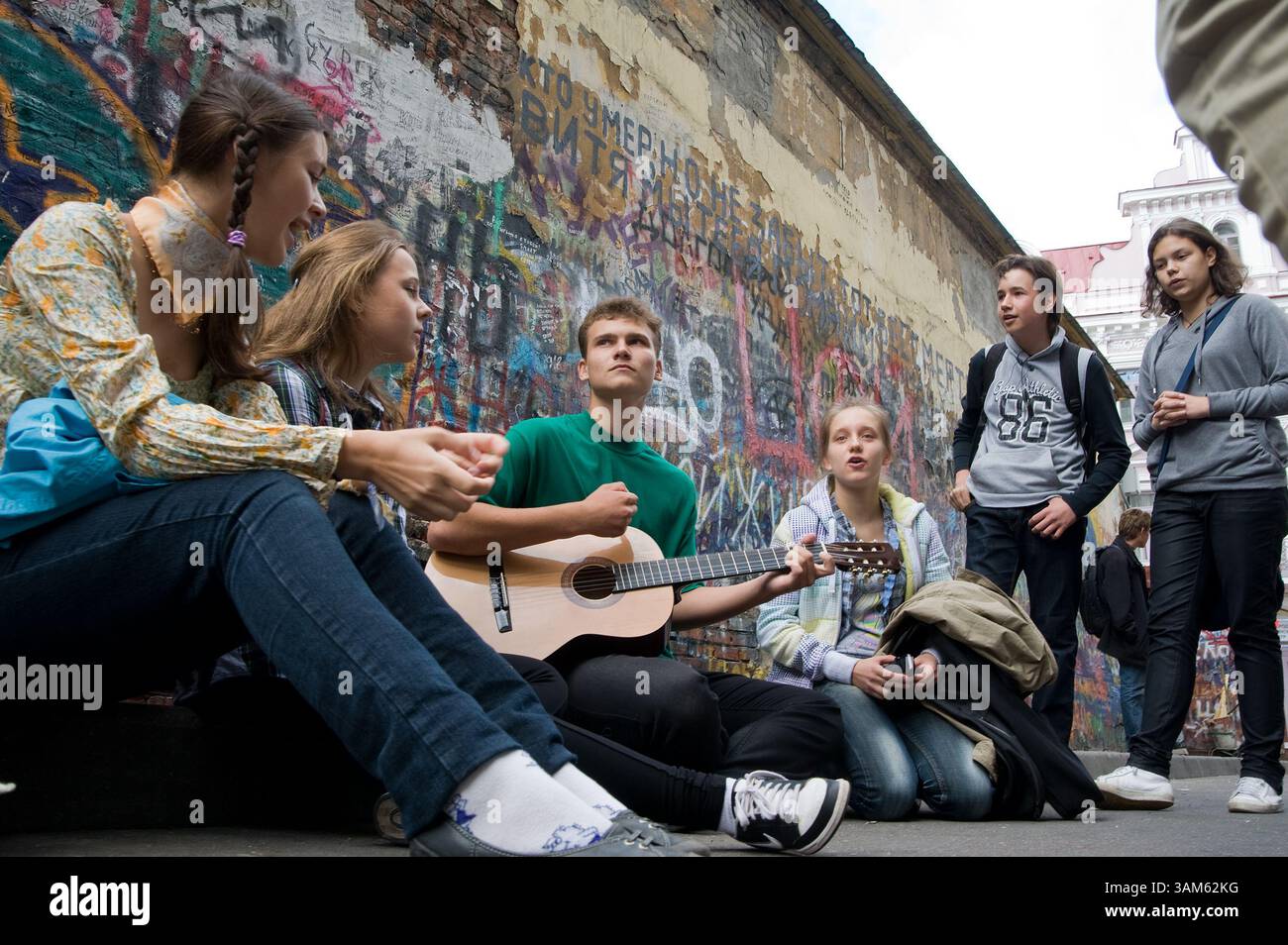 Young people sing songs of the Kino group at the Viktor Tsoi wall on ...