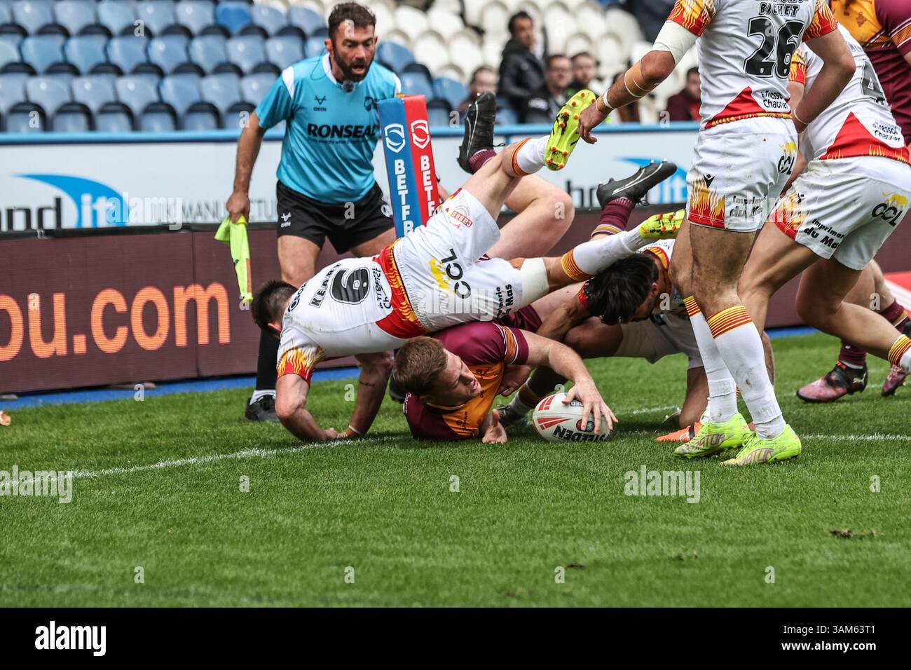 Sam Halsall of Huddersfield Giants goes over for a try during the ...