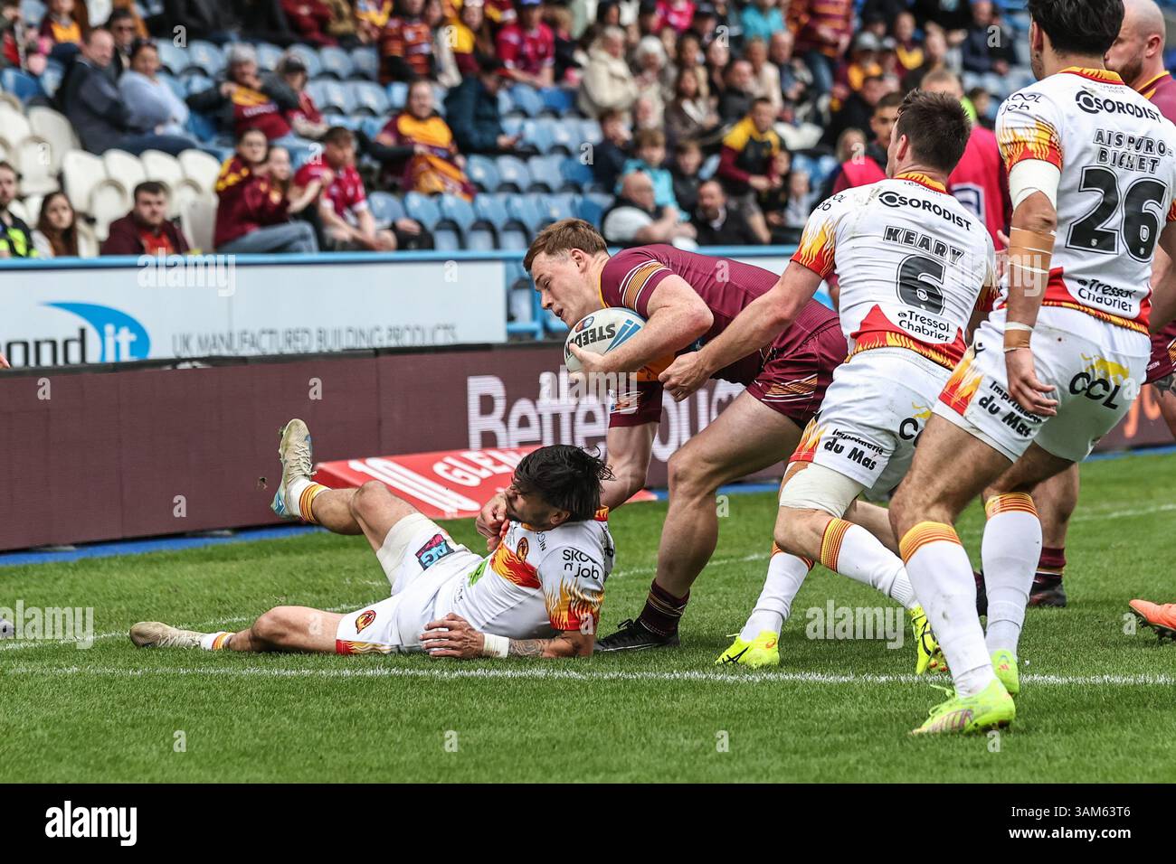 Sam Halsall of Huddersfield Giants goes over for a try during the ...