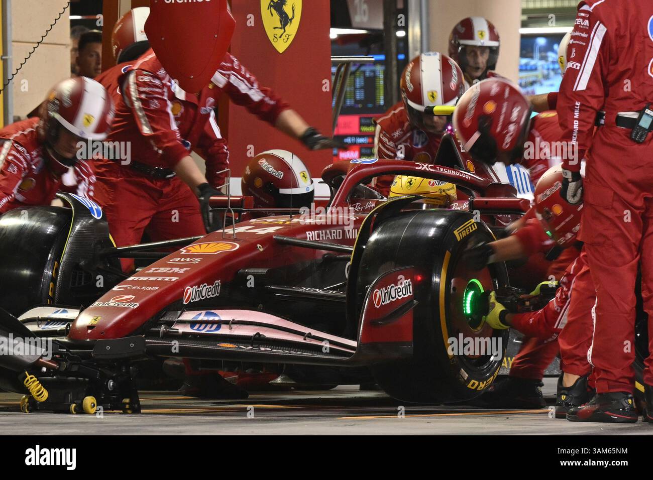 Ferrari driver Lewis Hamilton of Britain makes a pit stop during the ...