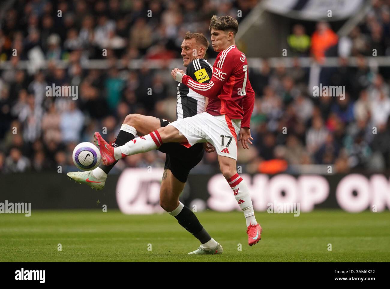 Newcastle United's Dan Burn (left) and Manchester United's Alejandro ...
