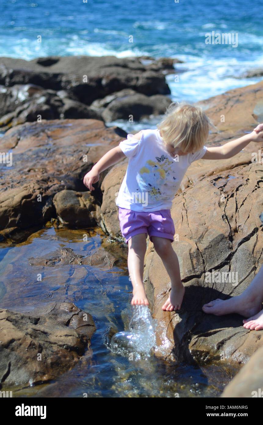 Family dipping toes in the ocean hi-res stock photography and images ...