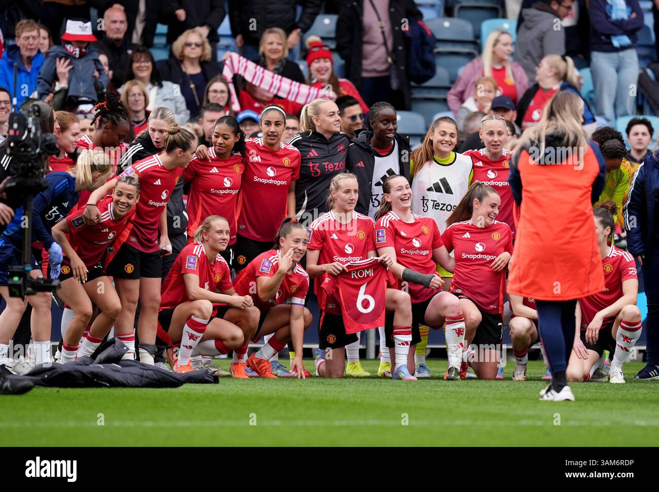 Manchester United's players celebrate on the pitch after the Adobe ...