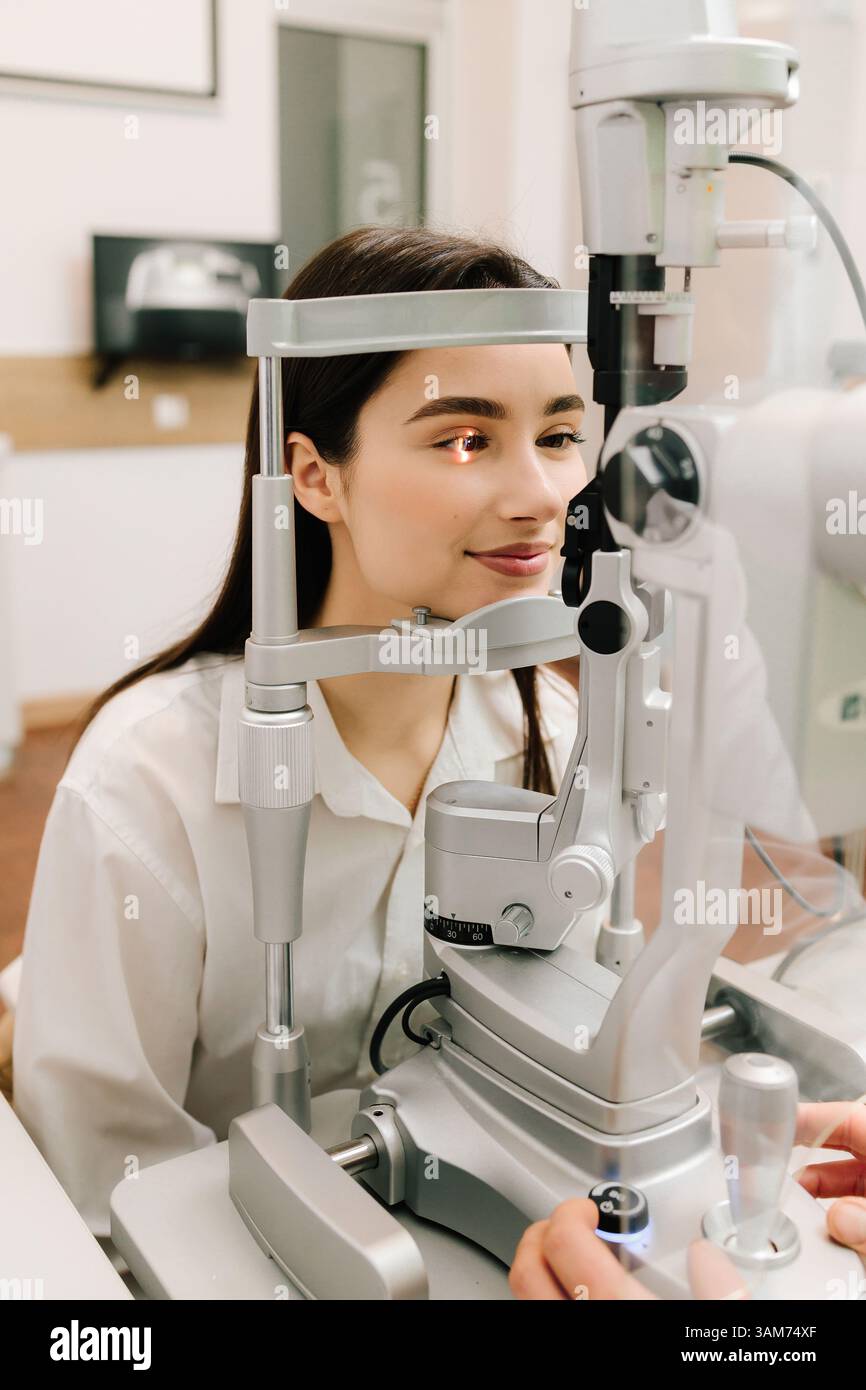 Slit lamp eye and cornea diagnostic at visiting ophthalmology clinic ...