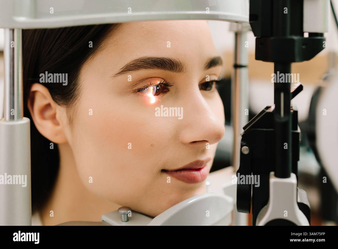 Slit lamp eye and cornea diagnostic at visiting ophthalmology clinic ...