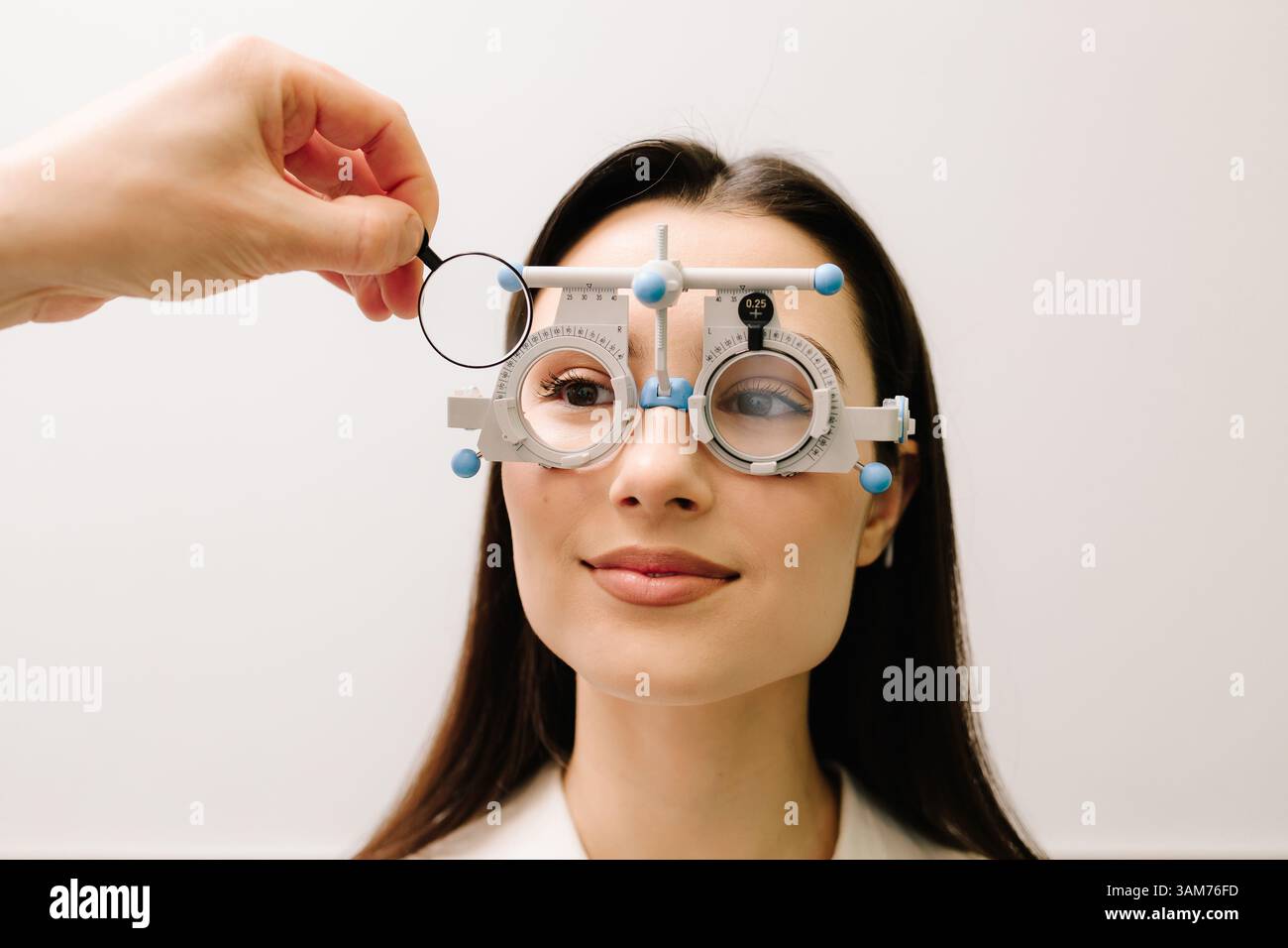 Trial frame glasses to determine the correct prescription lenses. Girl is wearing trial frame ...