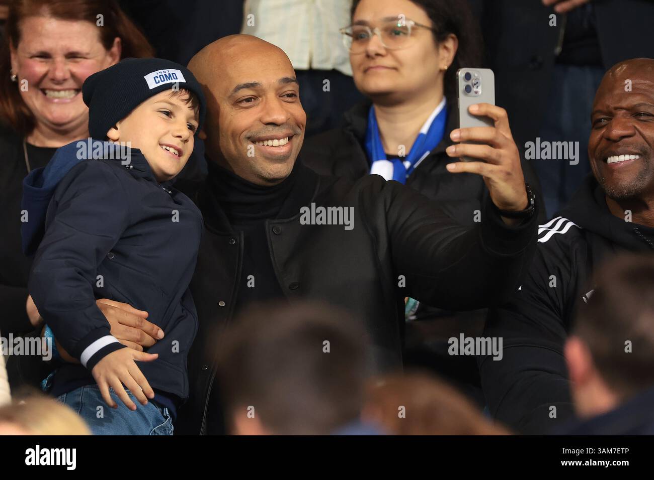 Como, Italy. 13th Apr, 2025. Theirry Henry poses for a photo with a ...