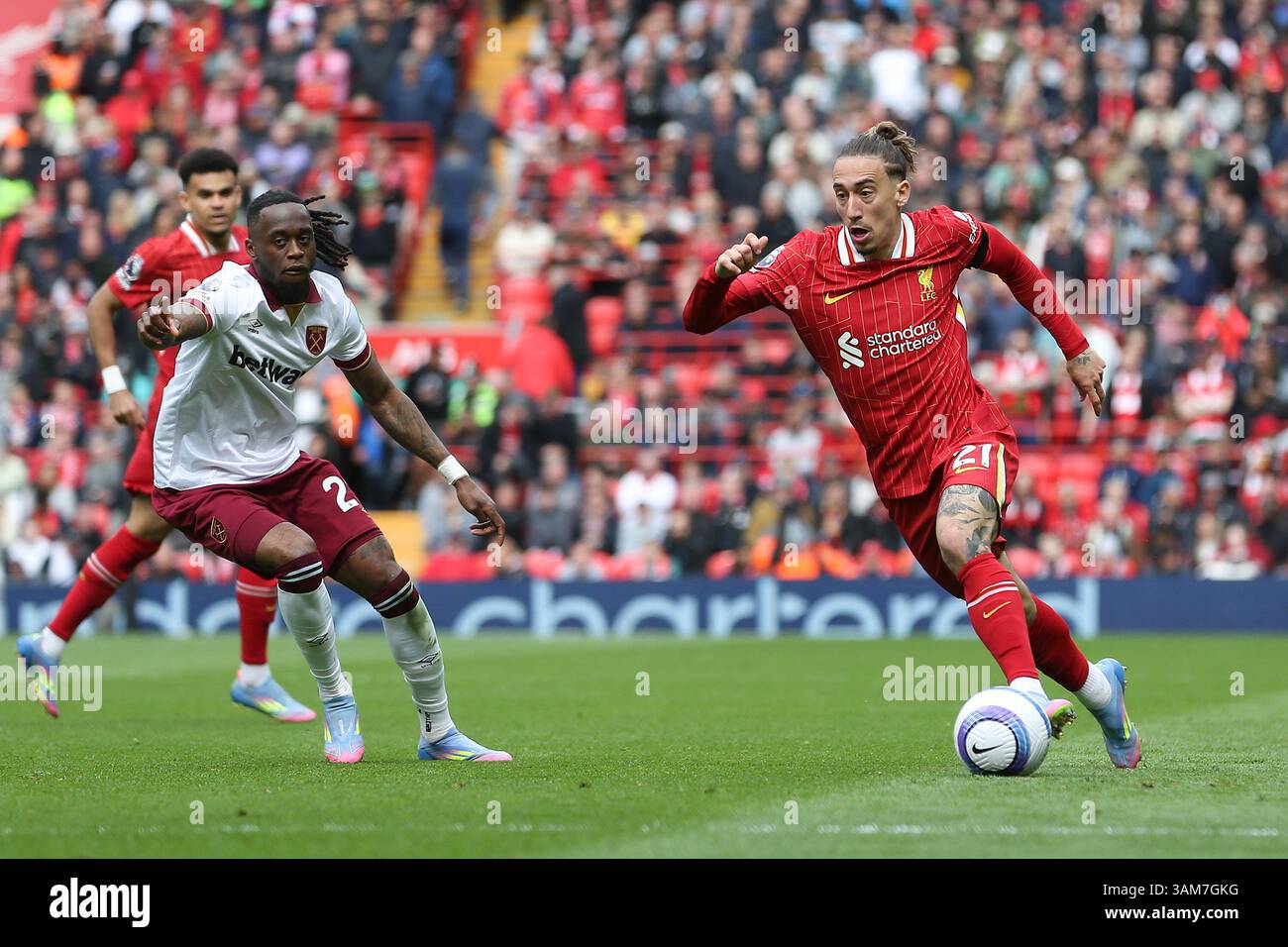 Liverpool, UK. 13th Apr, 2025. Kostas Tsimikas of Liverpool looks to ...