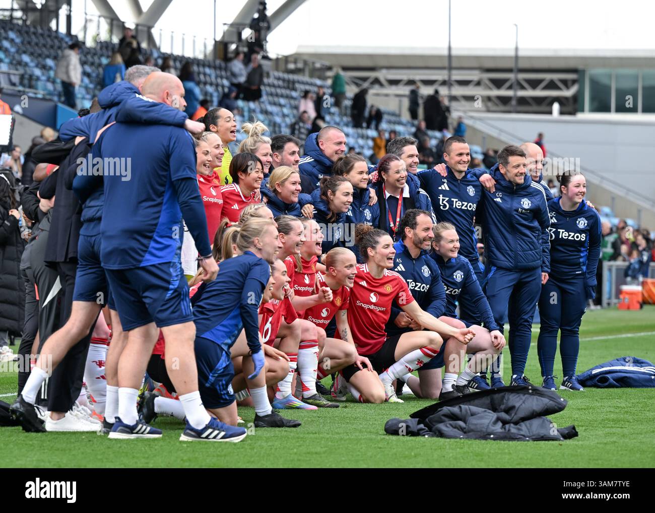 Manchester, UK. 13th Apr, 2025. Manchester United Women players and staff celebrate the full ...