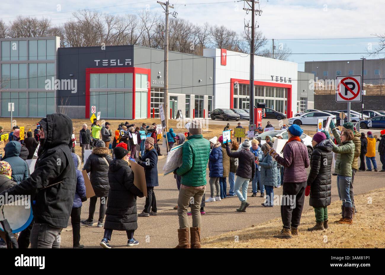 Peaceful anti-Elon Musk DOGE protesters across the street leading to a ...